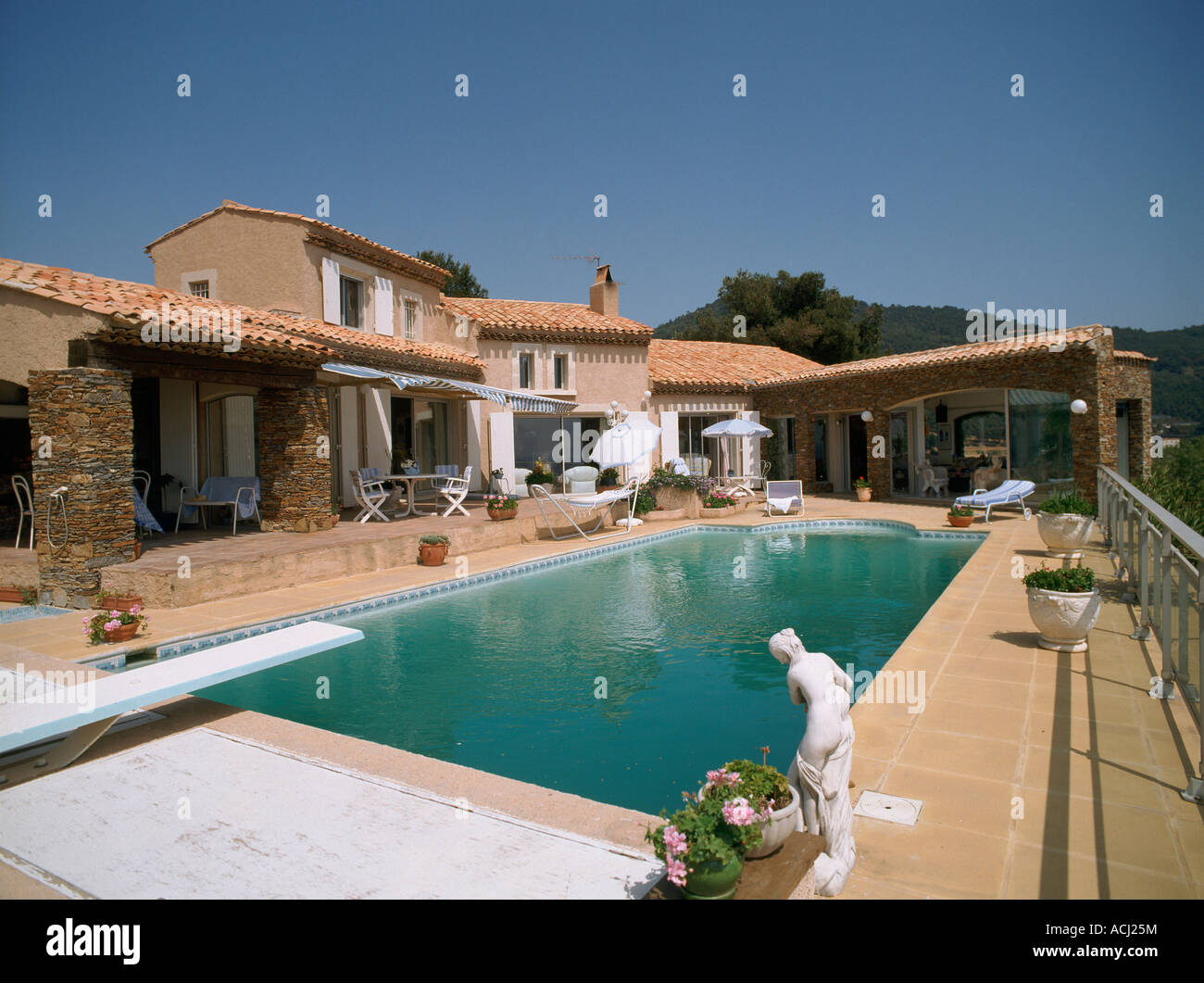 House swimming pool statue Stock Photo - Alamy