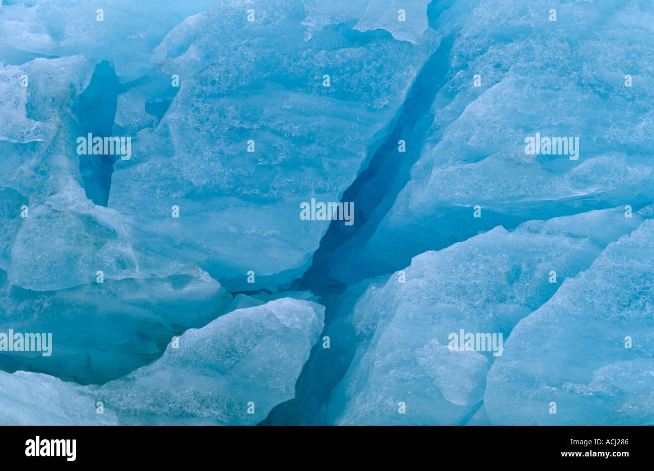 Blue ice Iceberg calved from glacier floating in the Arctic Ocean near ...