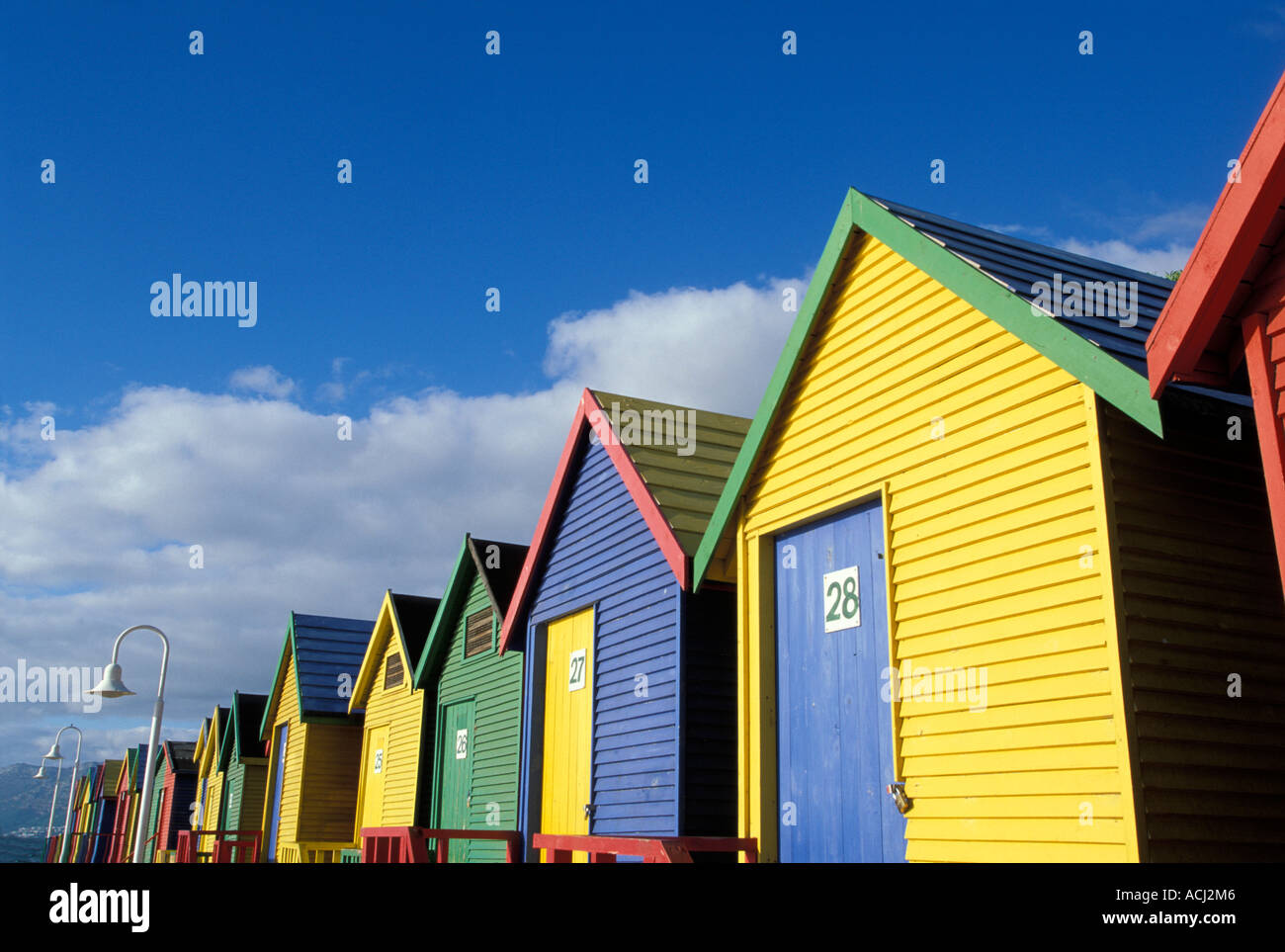 South Africa Cape Town Brightly painted bath houses along beach in ...