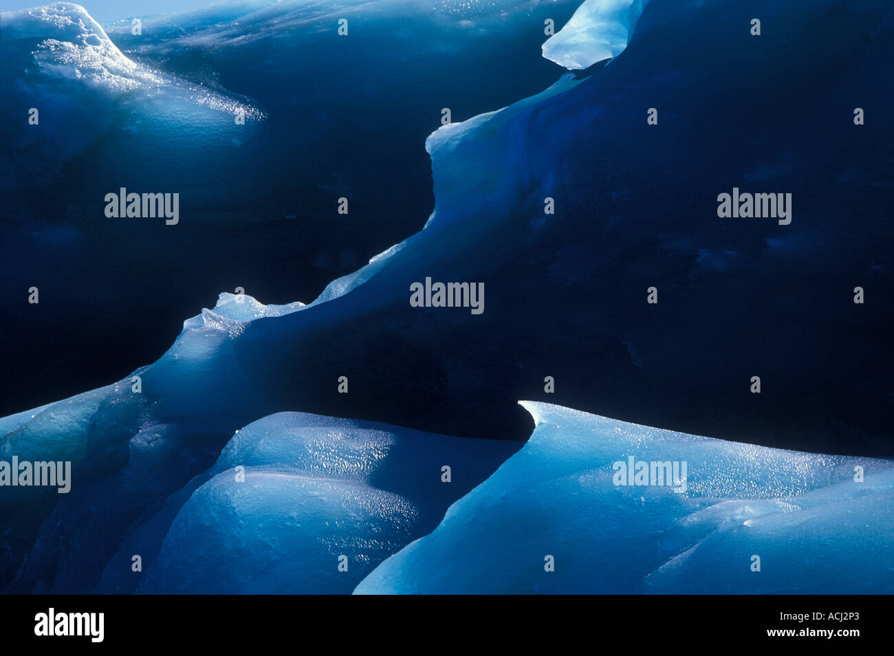 Antarctica Morning sun lights deep blue iceberg floating north of ...