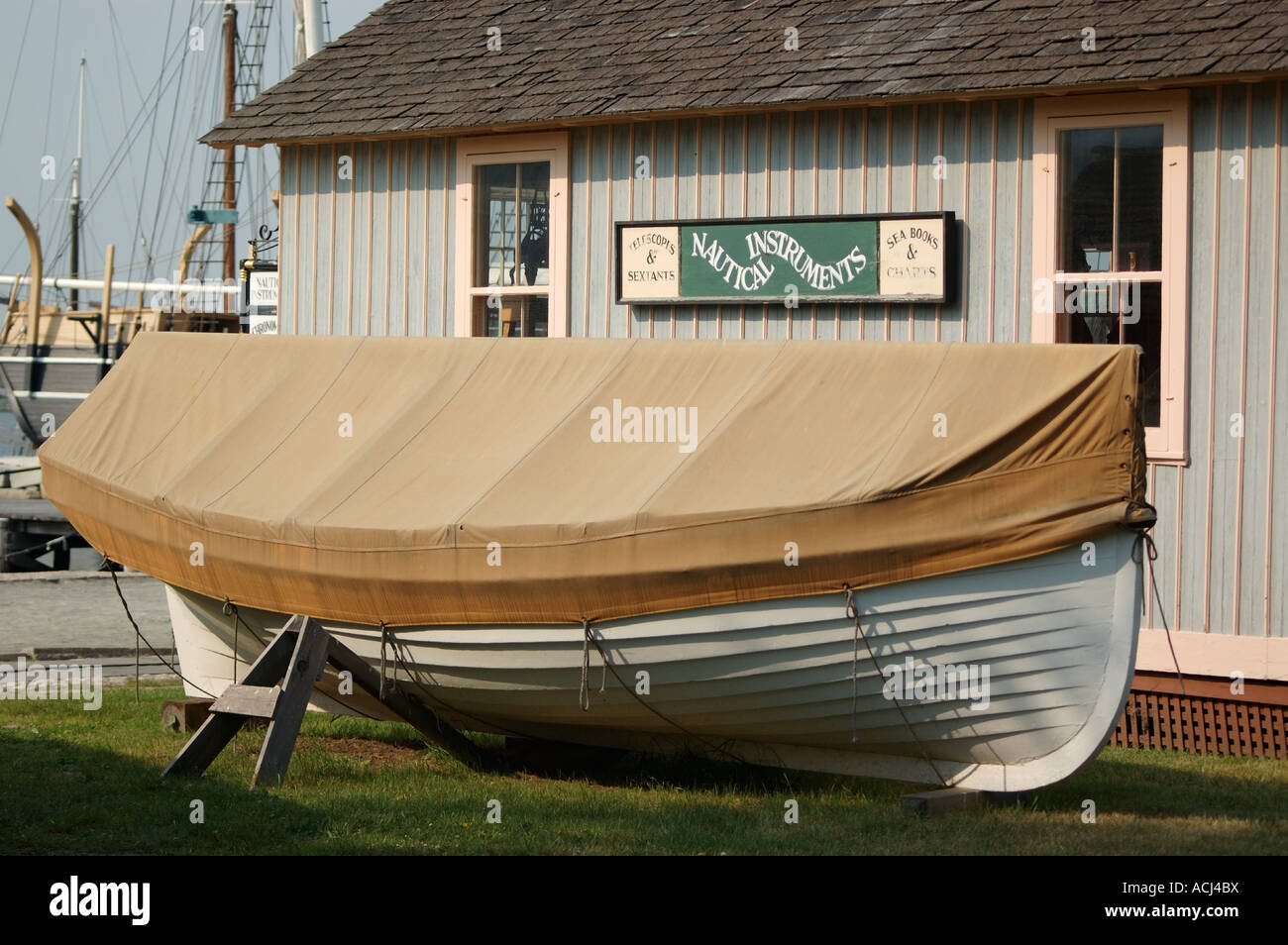 A small boat covered with a tarpaulin Stock Photo - Alamy