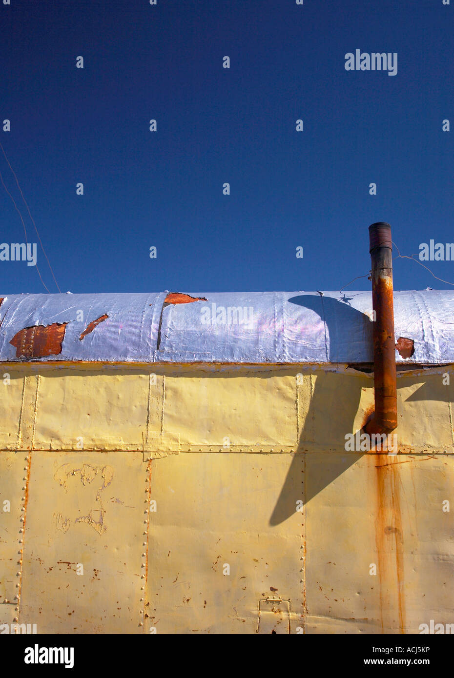 yellow portable cabin with chimney Stock Photo - Alamy