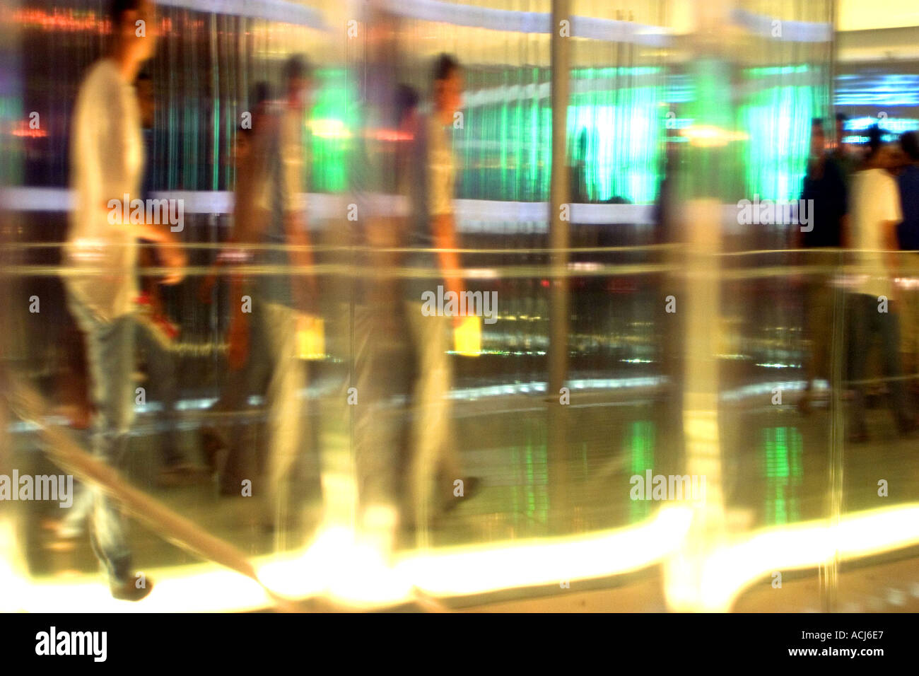 Distorted people as viewed through an undulating perspex screen Stock ...