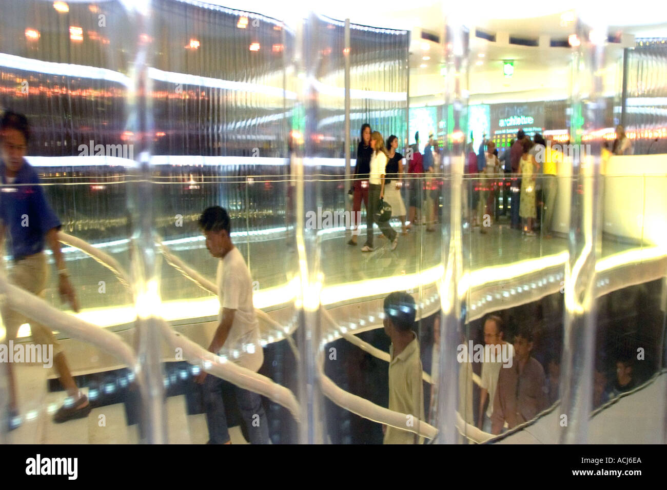 Distorted people as viewed through an undulating perspex screen Stock ...