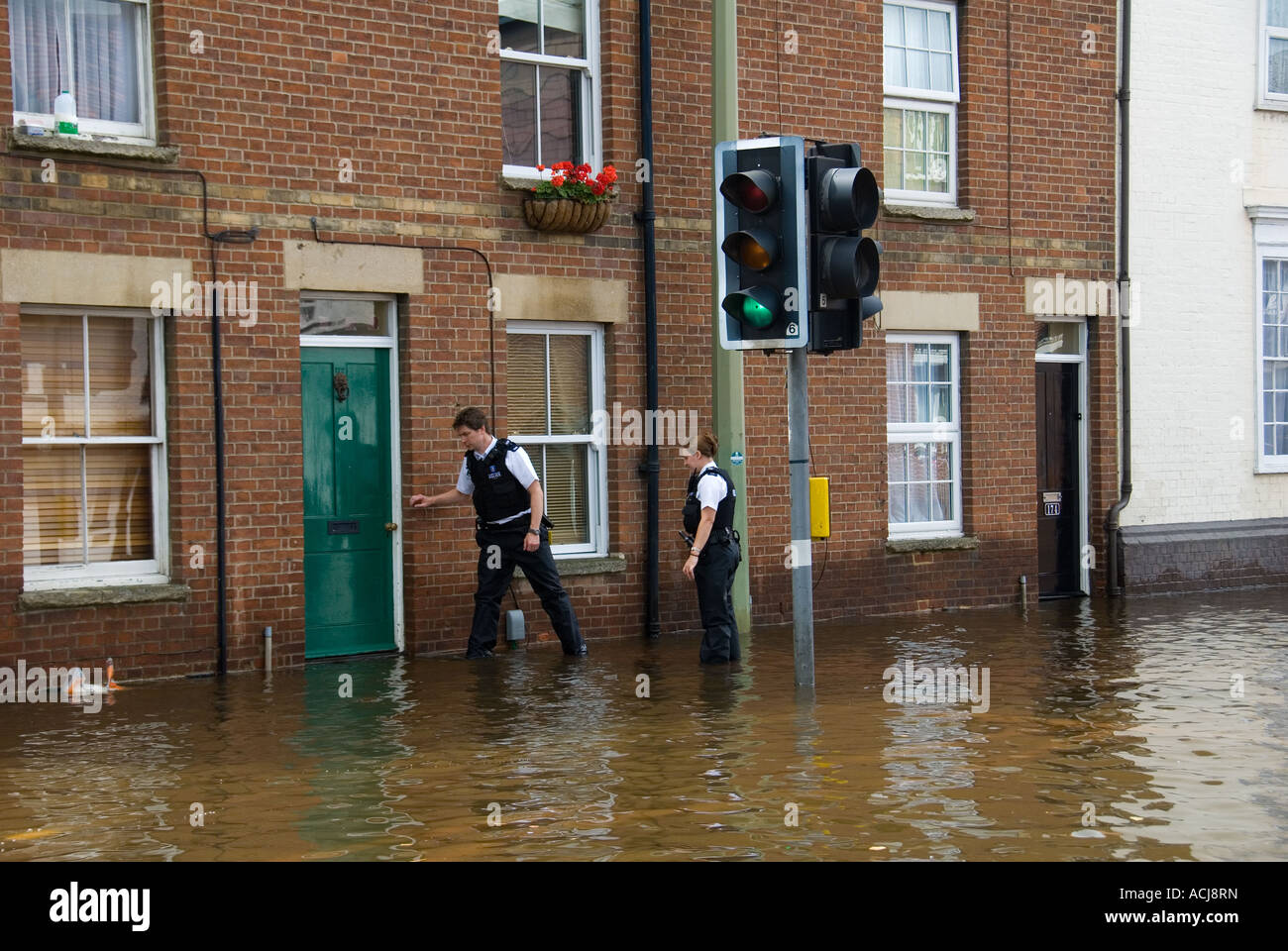 Two Police Officers on a Flooded Street Stock Photo - Alamy