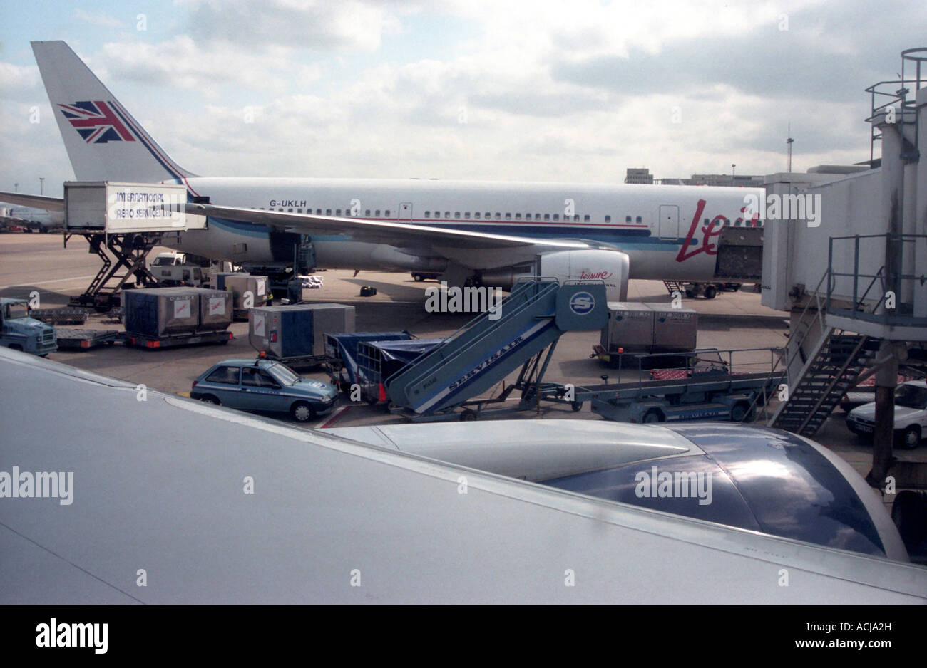 Loading aircraft before take off Stock Photo - Alamy