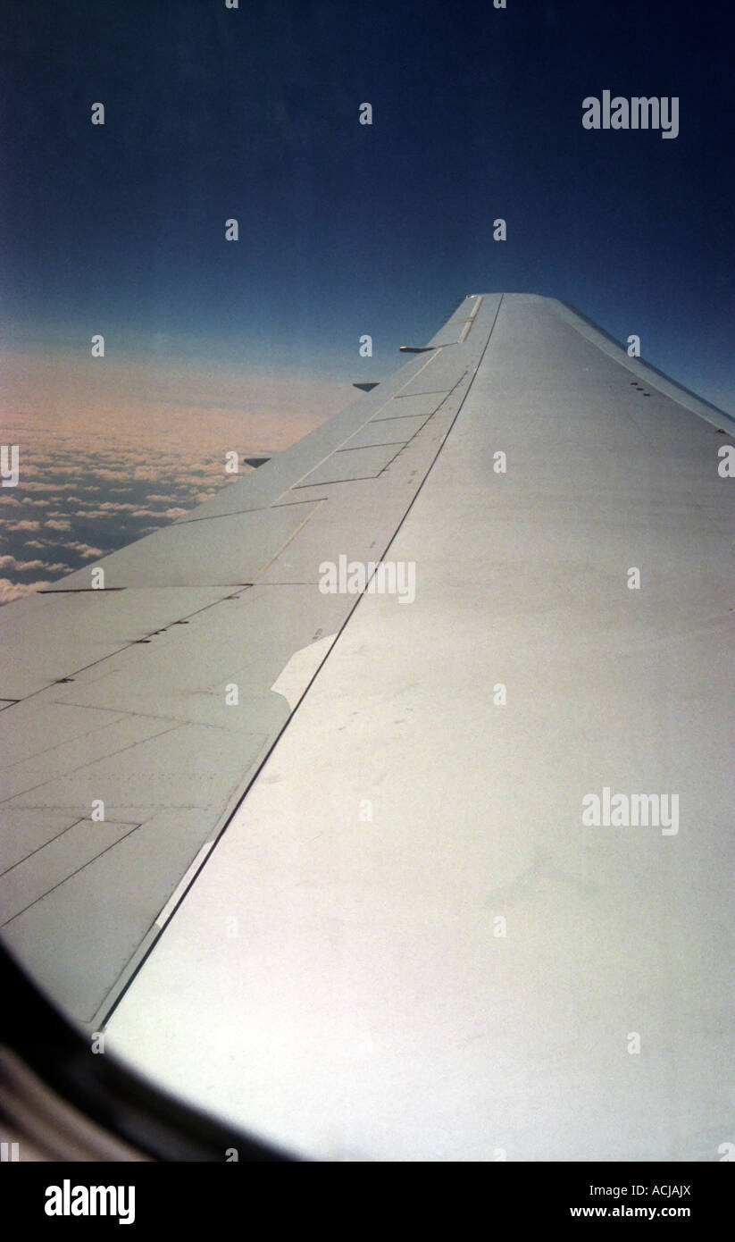 View from an aeroplane window overlooking the wing and jet engine Stock ...