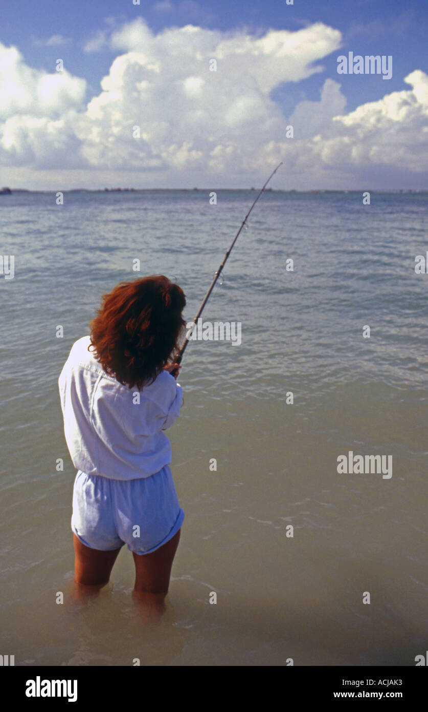 Girl Fishing from Shore Stock Photo - Alamy
