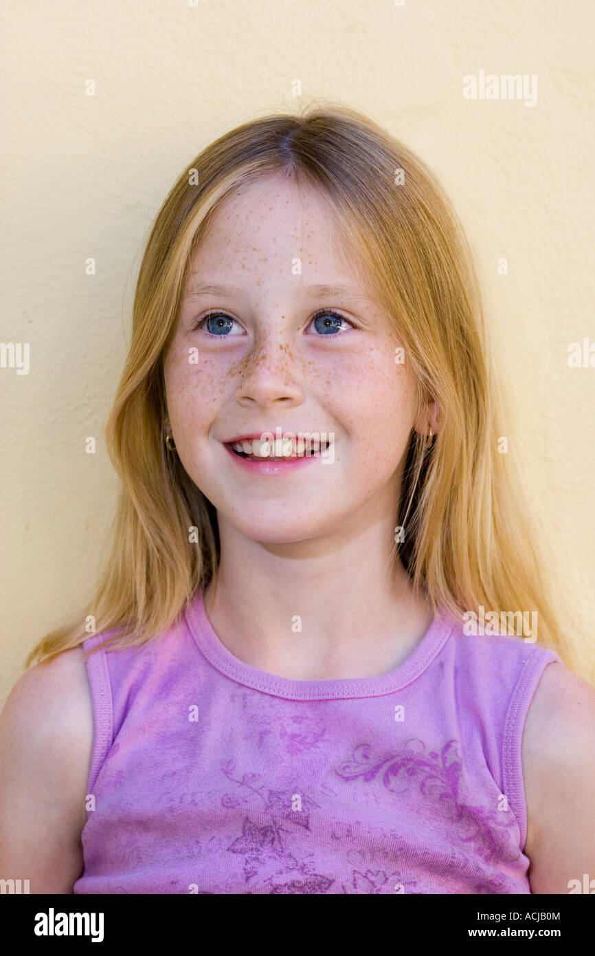 Portrait of blond girl age 9 with blue eyes and freckles smiling Stock ...
