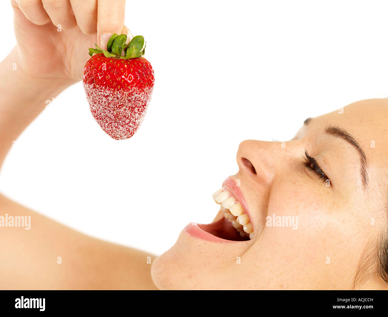Young Woman Eating a Strawberry Model Released Stock Photo - Alamy