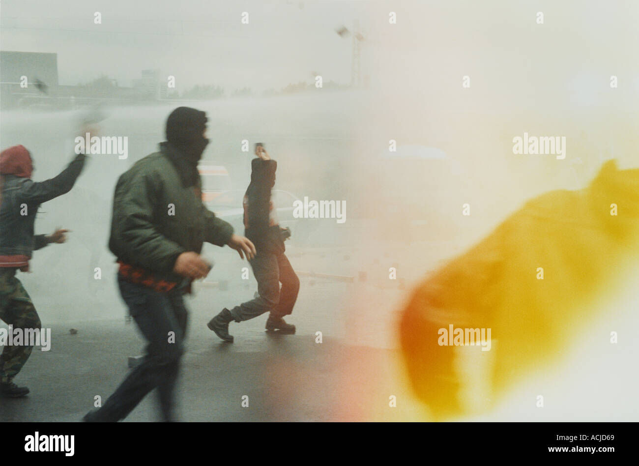 Rioters throwing stones Stock Photo - Alamy