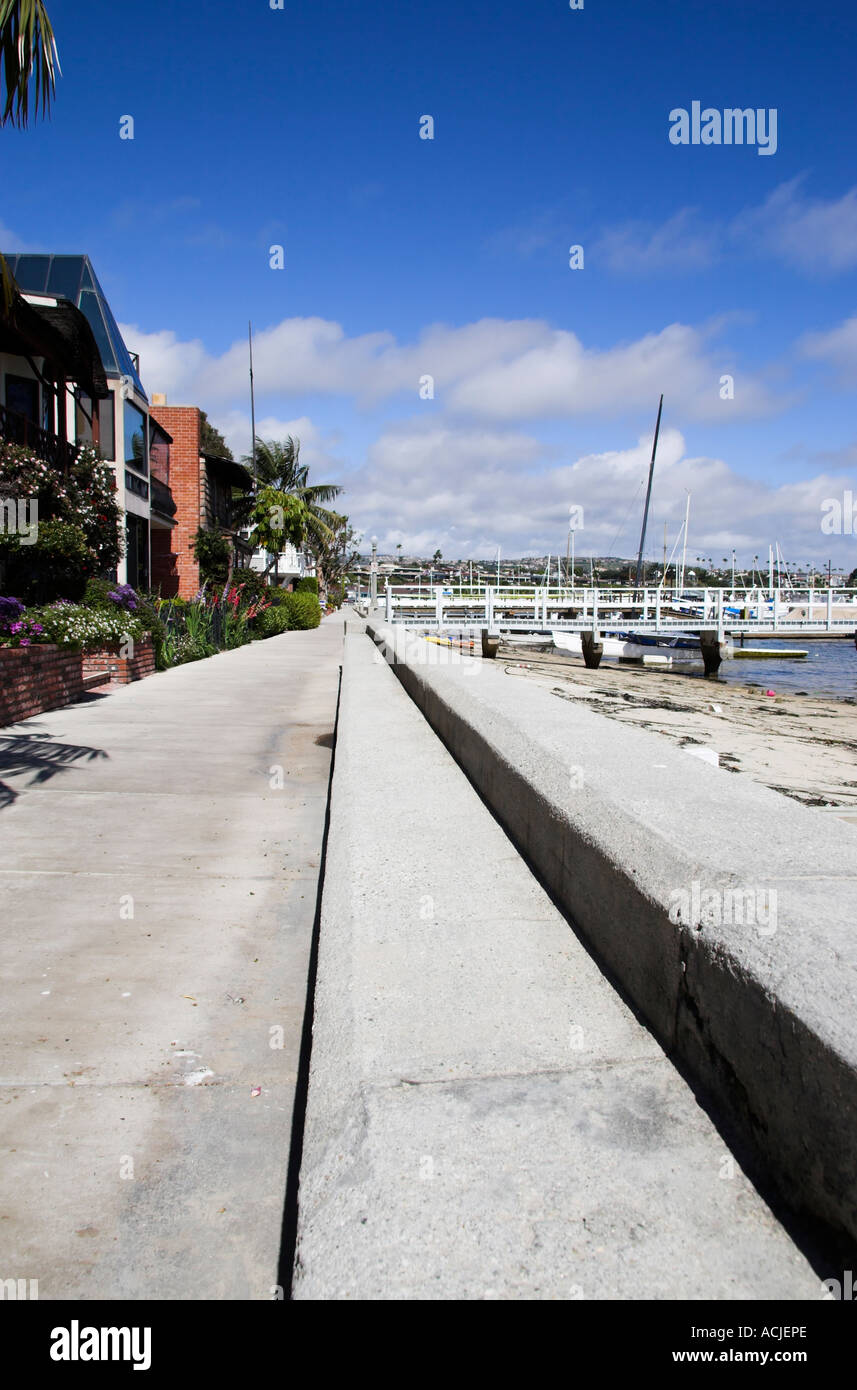 A waterfront sidewalk on Balboa Island, Newport Beach, California, USA ...
