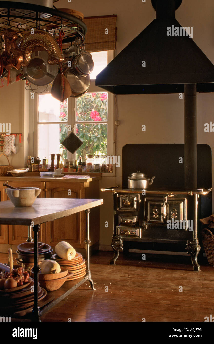 Kitchen gas furnace with hood table laid casserole suspended Stock ...