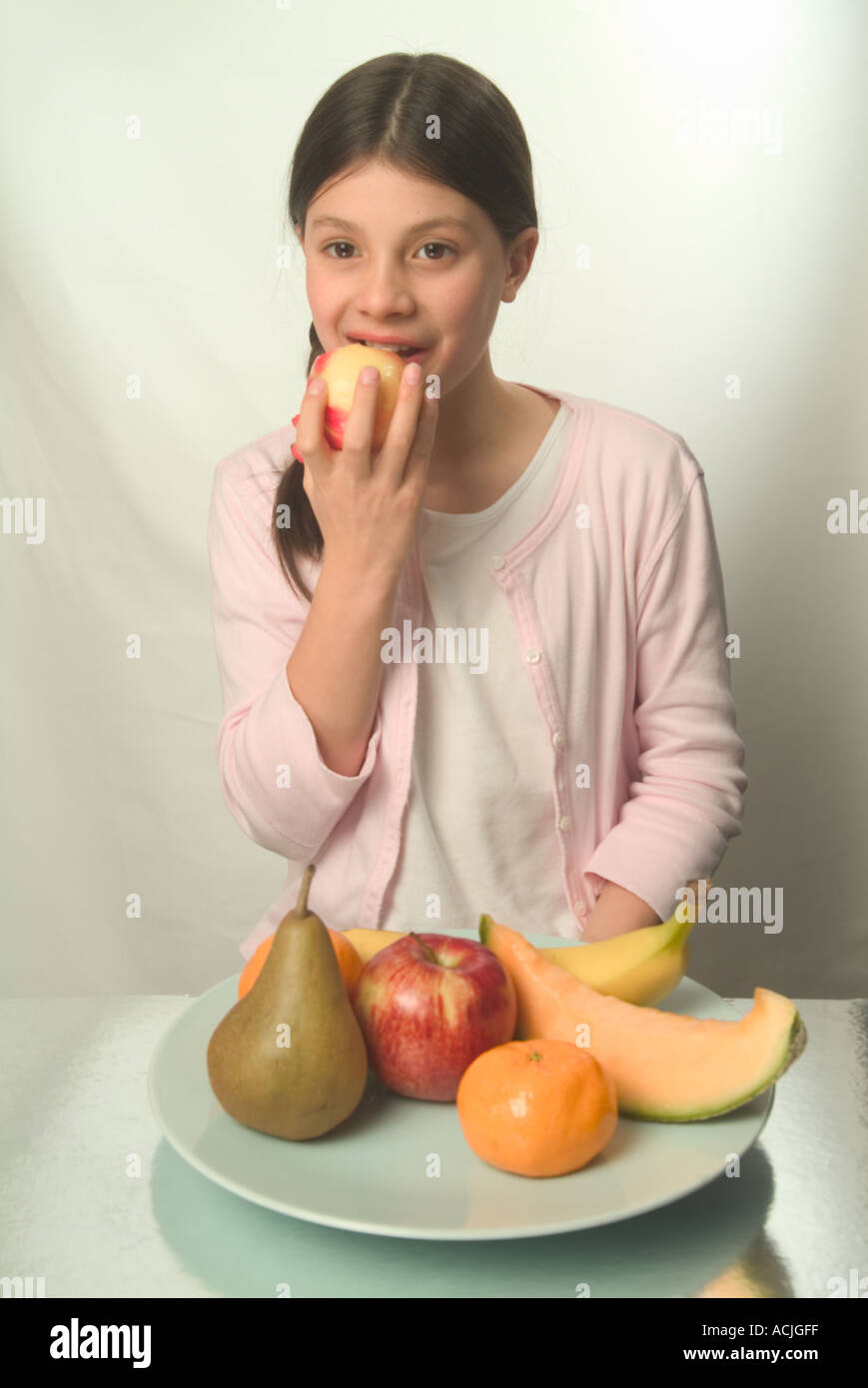 9 Year Old Girl Eating An Apple Stock Photo Alamy 9-year-old-girl-eating-an-apple-stock-photo-alamy