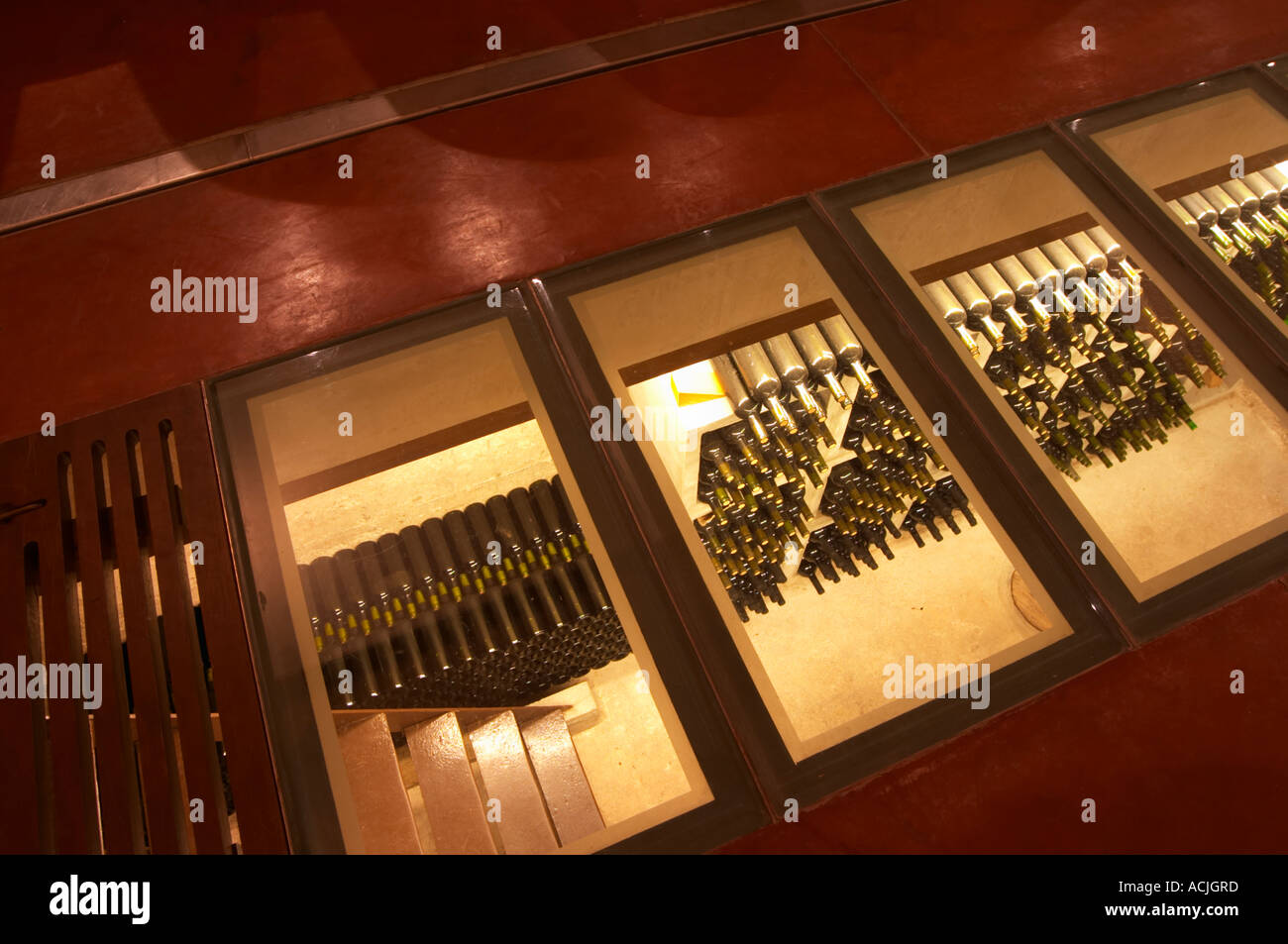 The barrel aging cellar with barriques and bottles. and the private ...