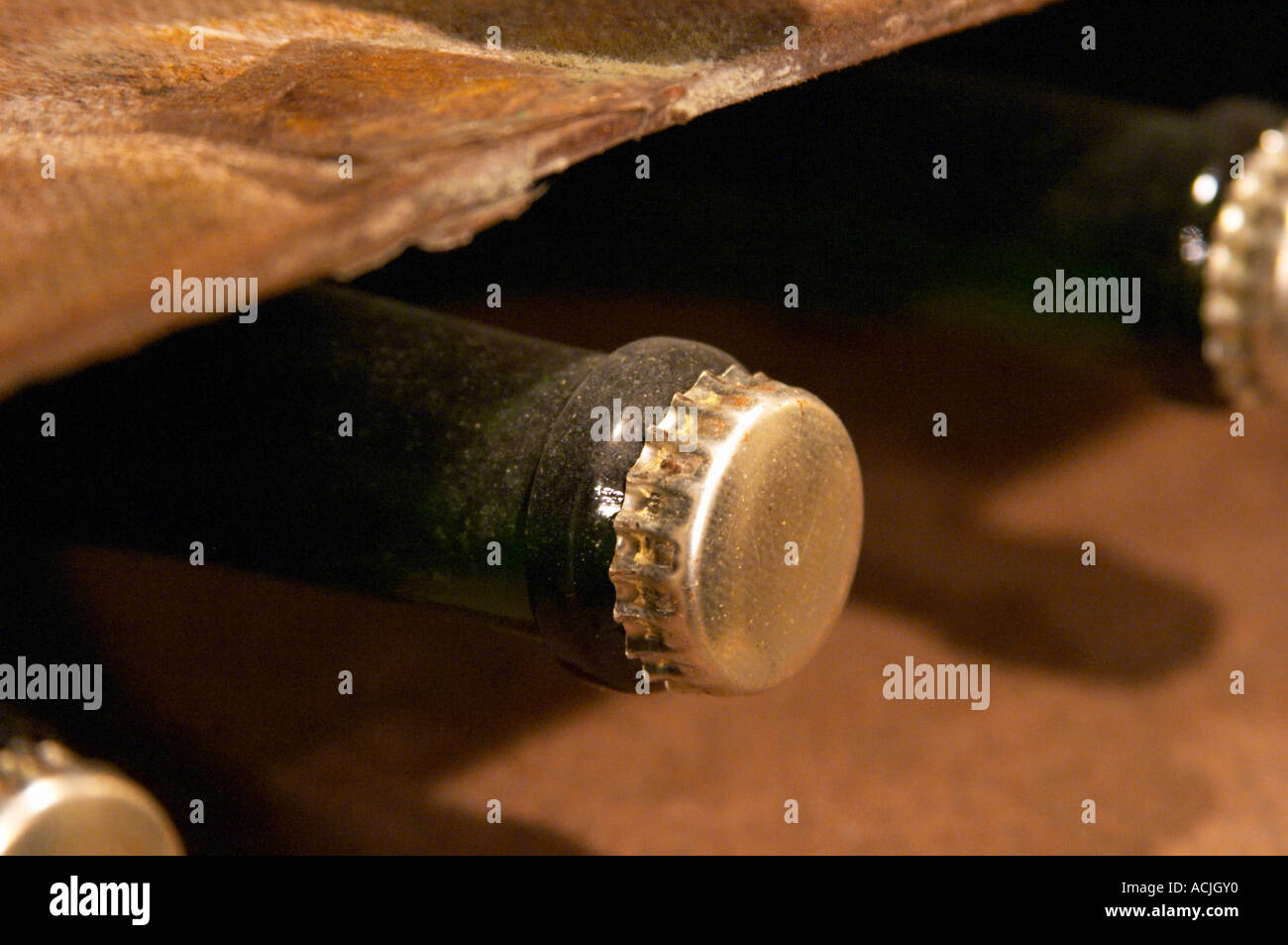 Bottles of sparkling wine sur lattes getting bottle age with a beer ...
