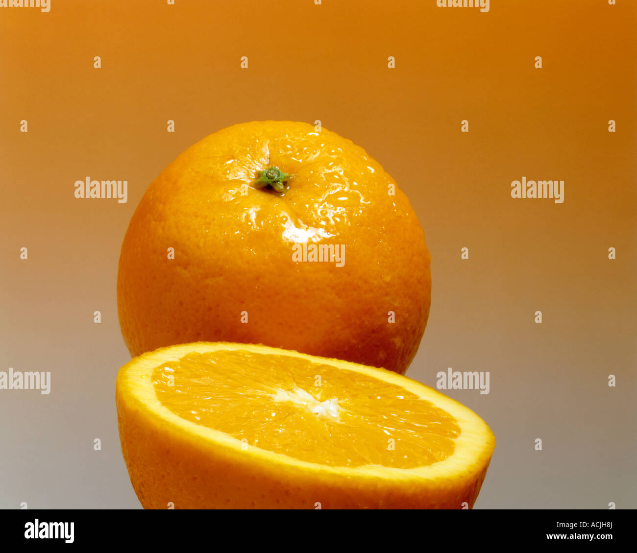 Elevated view on orange and a half water drops Stock Photo - Alamy