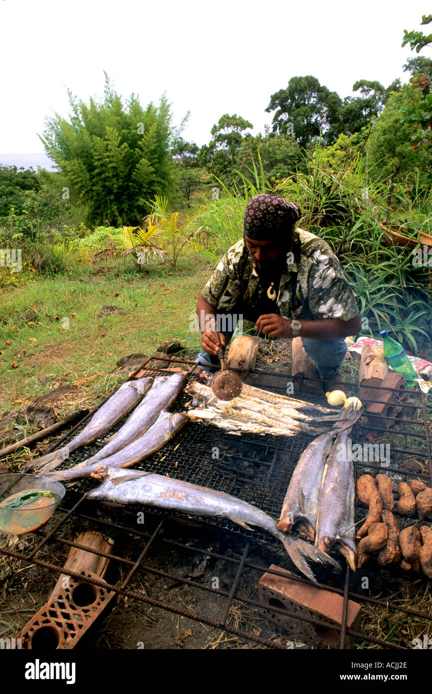 Native man cooking fish on grill Easter Island during Tapati Festival ...