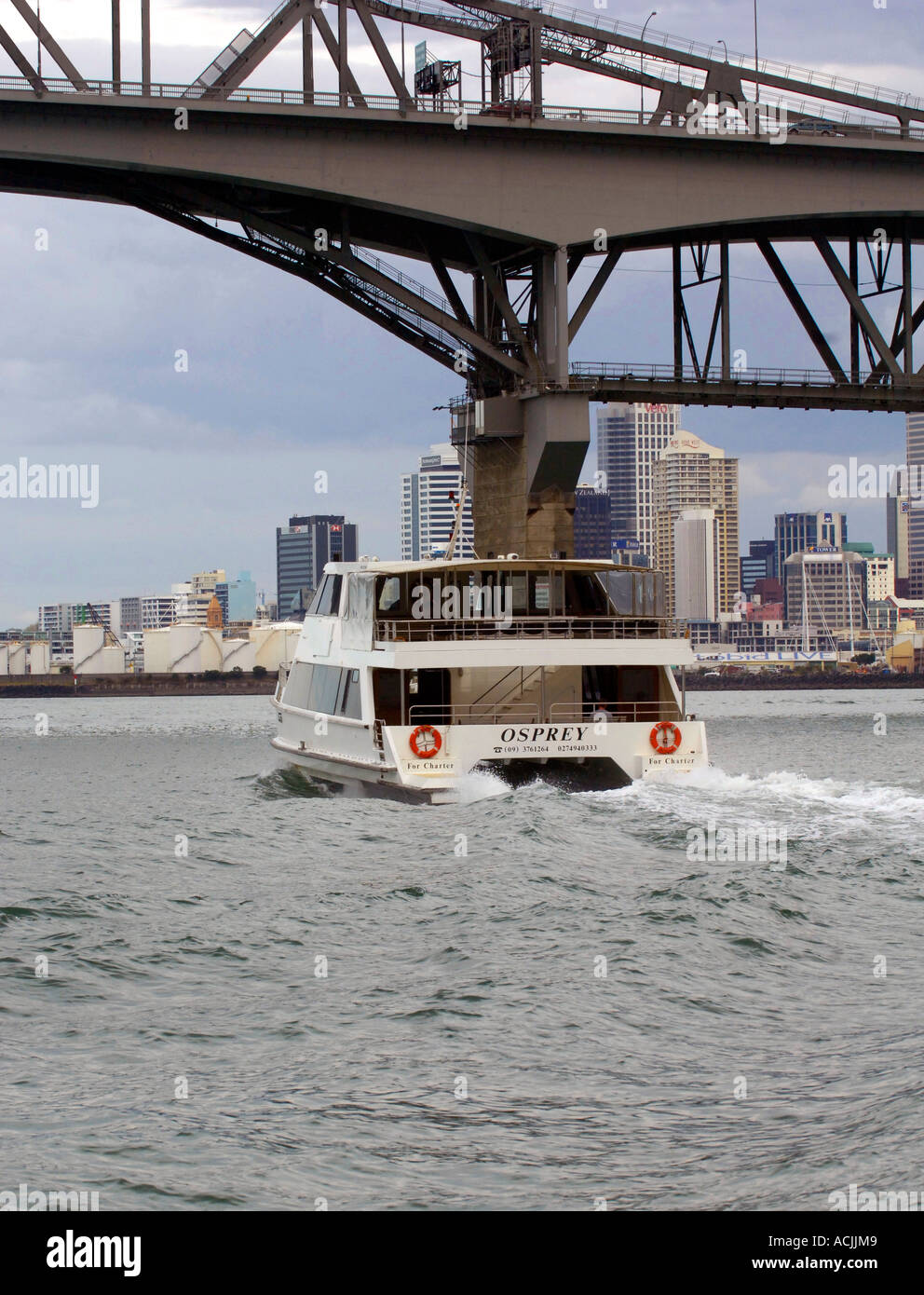 Fullers ferry passing under Auckland harbour bridge, Auckland New ...