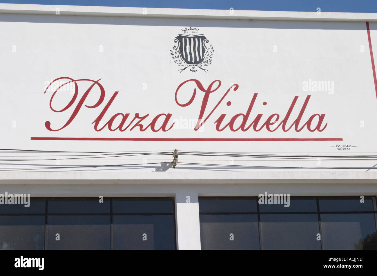 Outside the winery with a name painted in red on a white wall. Bodega ...