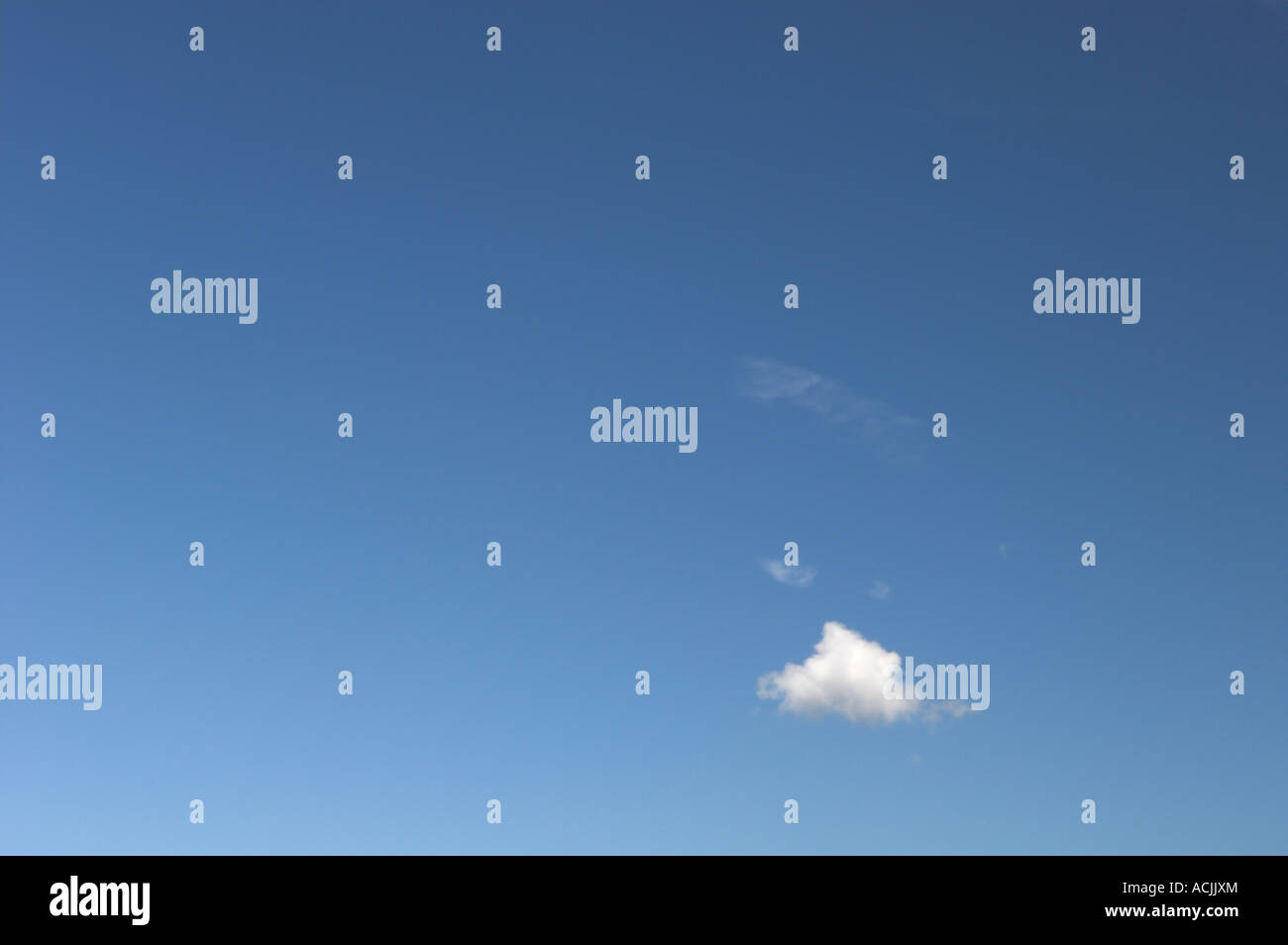 Single small white cumulus cloud in blue sky Stock Photo - Alamy