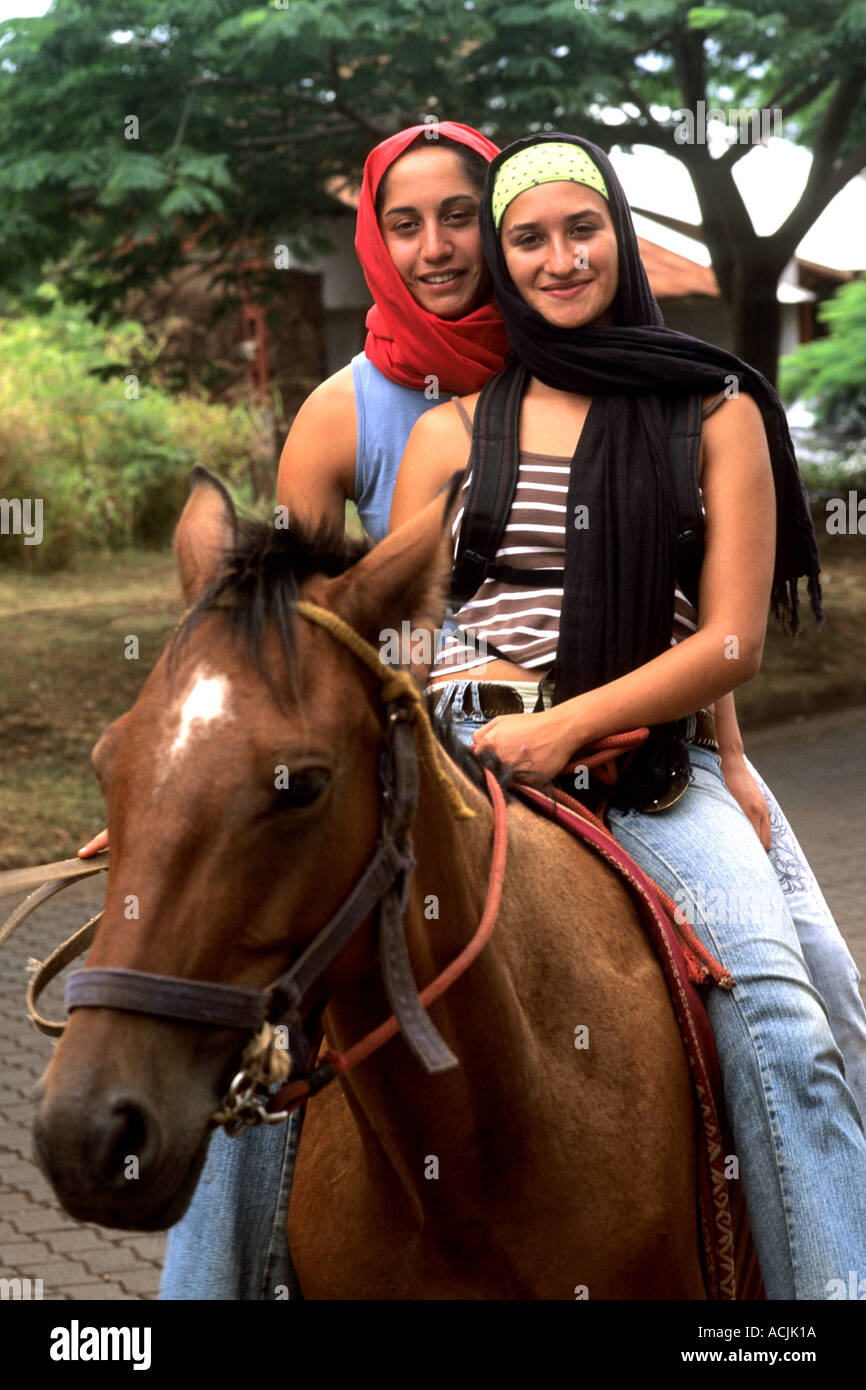 Colorful native women on horseback Easter Island during Tapati Festival ...