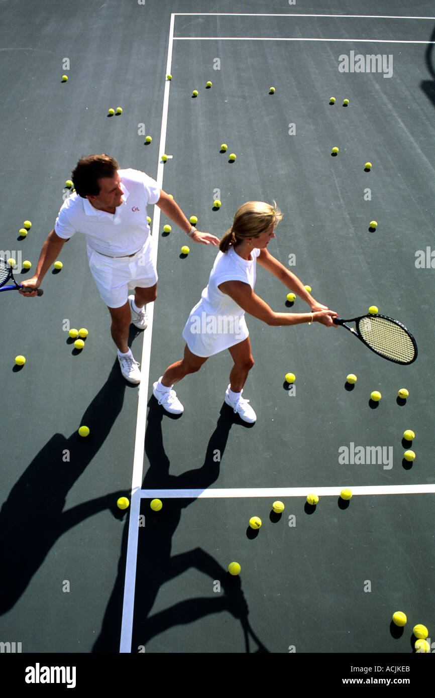 Graphic image of couple practicing tennis Stock Photo - Alamy