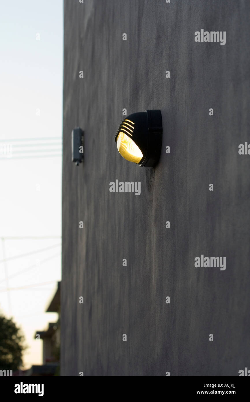 Light fixed connected on brick rendered render wall Stock Photo - Alamy