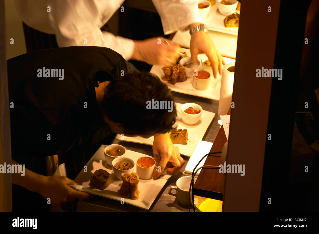 The food being prepared in the kitchen before being served to guests at ...