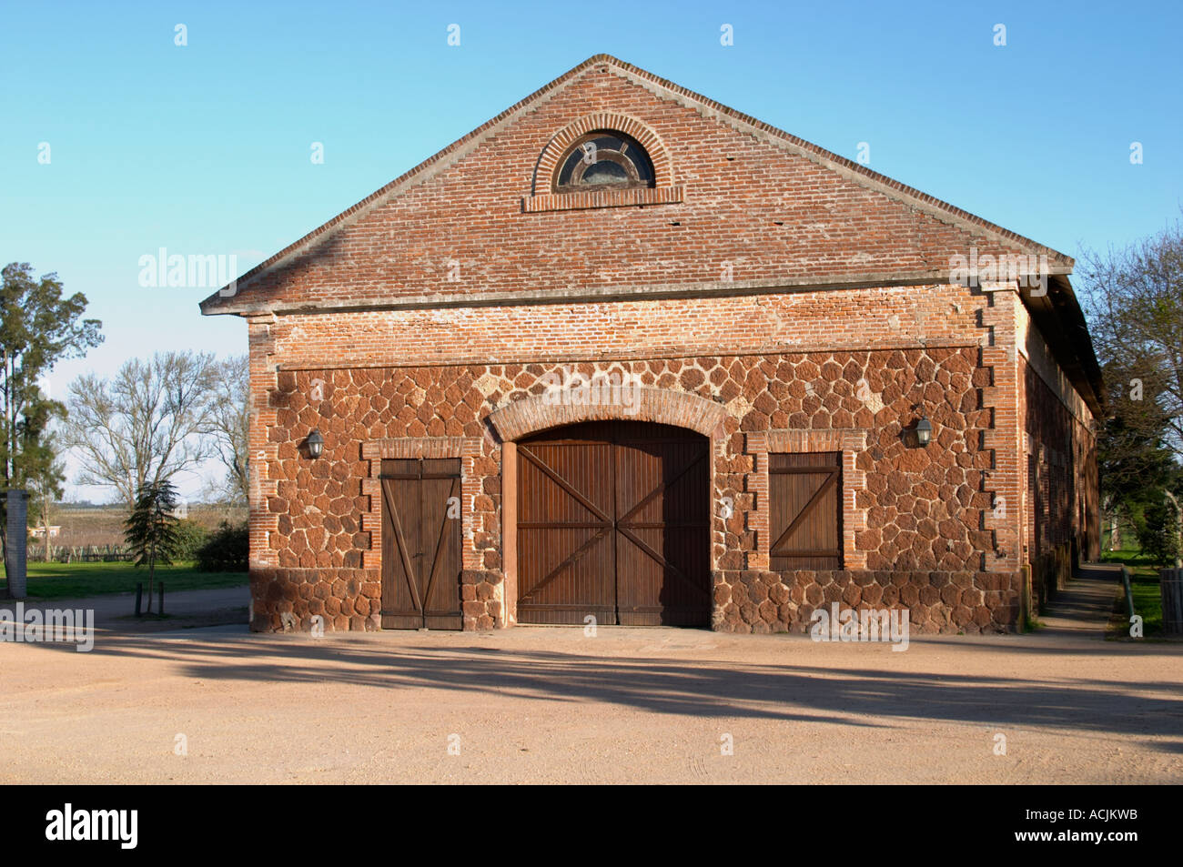 One of the vineyard buildings built in brick and stone. Bodega Juanico ...