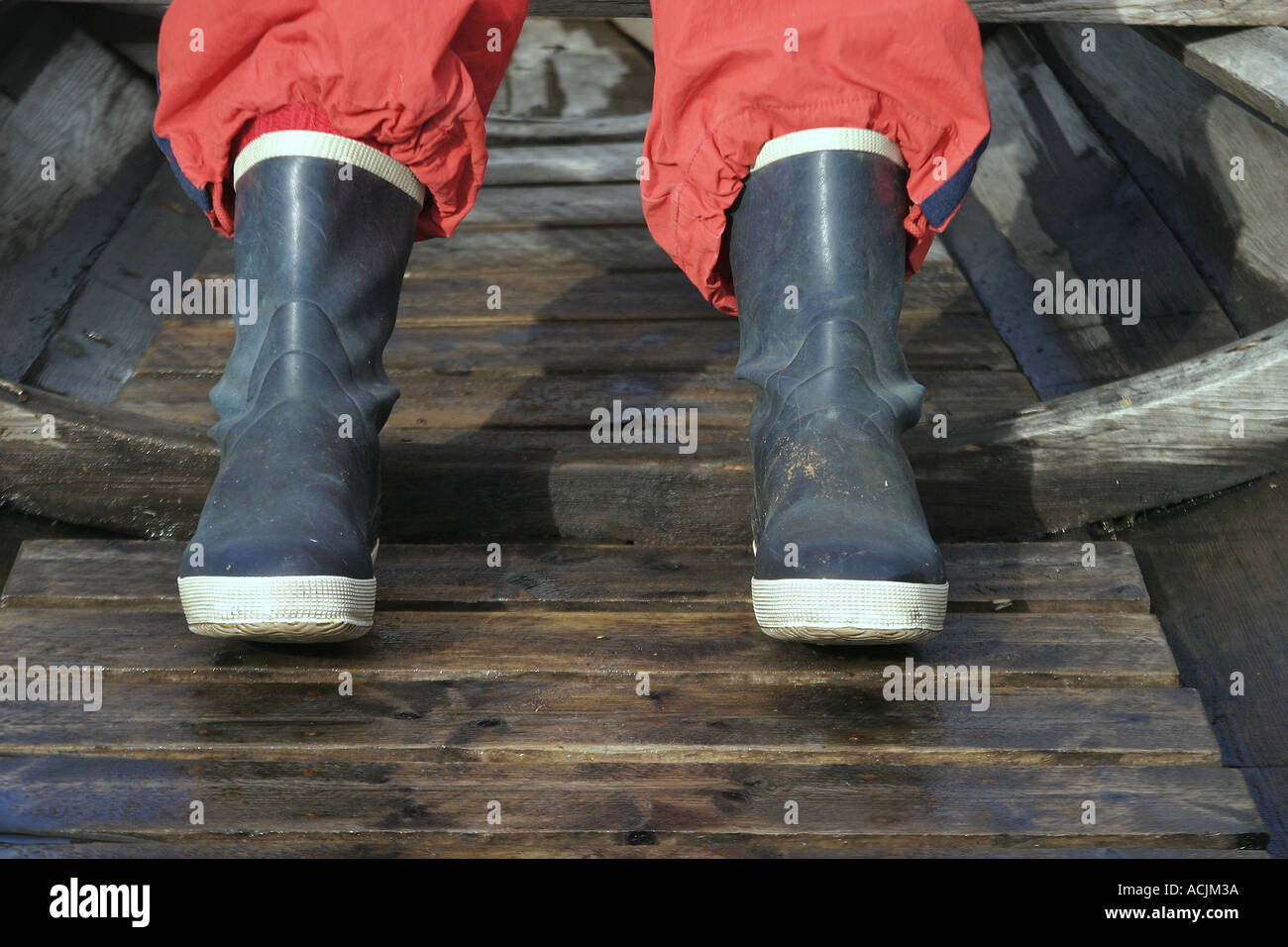 rubber boot detail in an old vintage fishing boat Stock Photo - Alamy