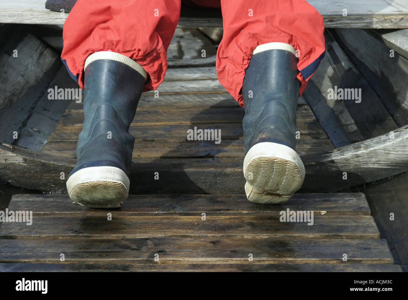 rubber boot detail in an old vintage fishing boat Stock Photo - Alamy