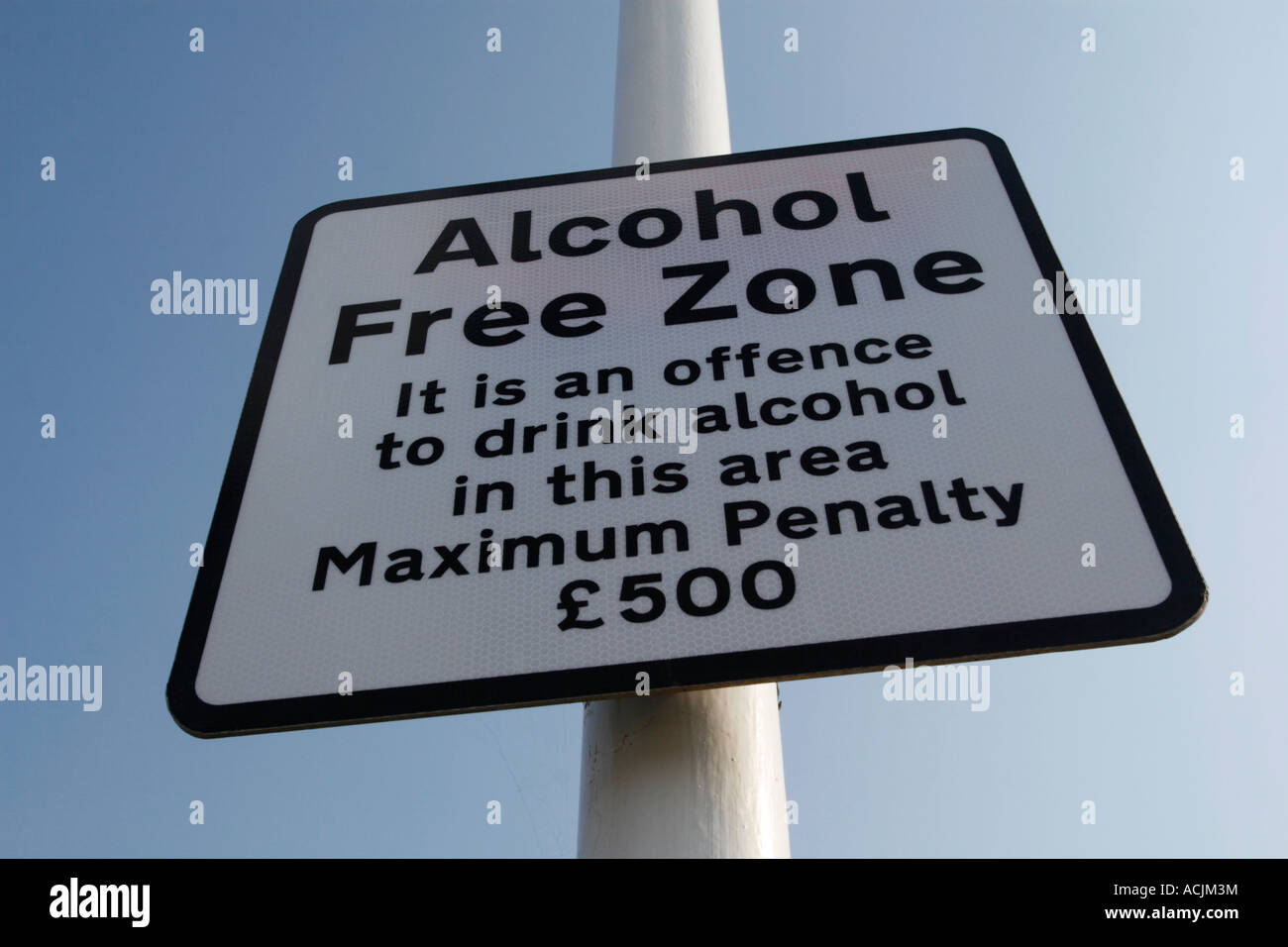 An image of lamppost sign designating an area as an alcohol-free zone ...