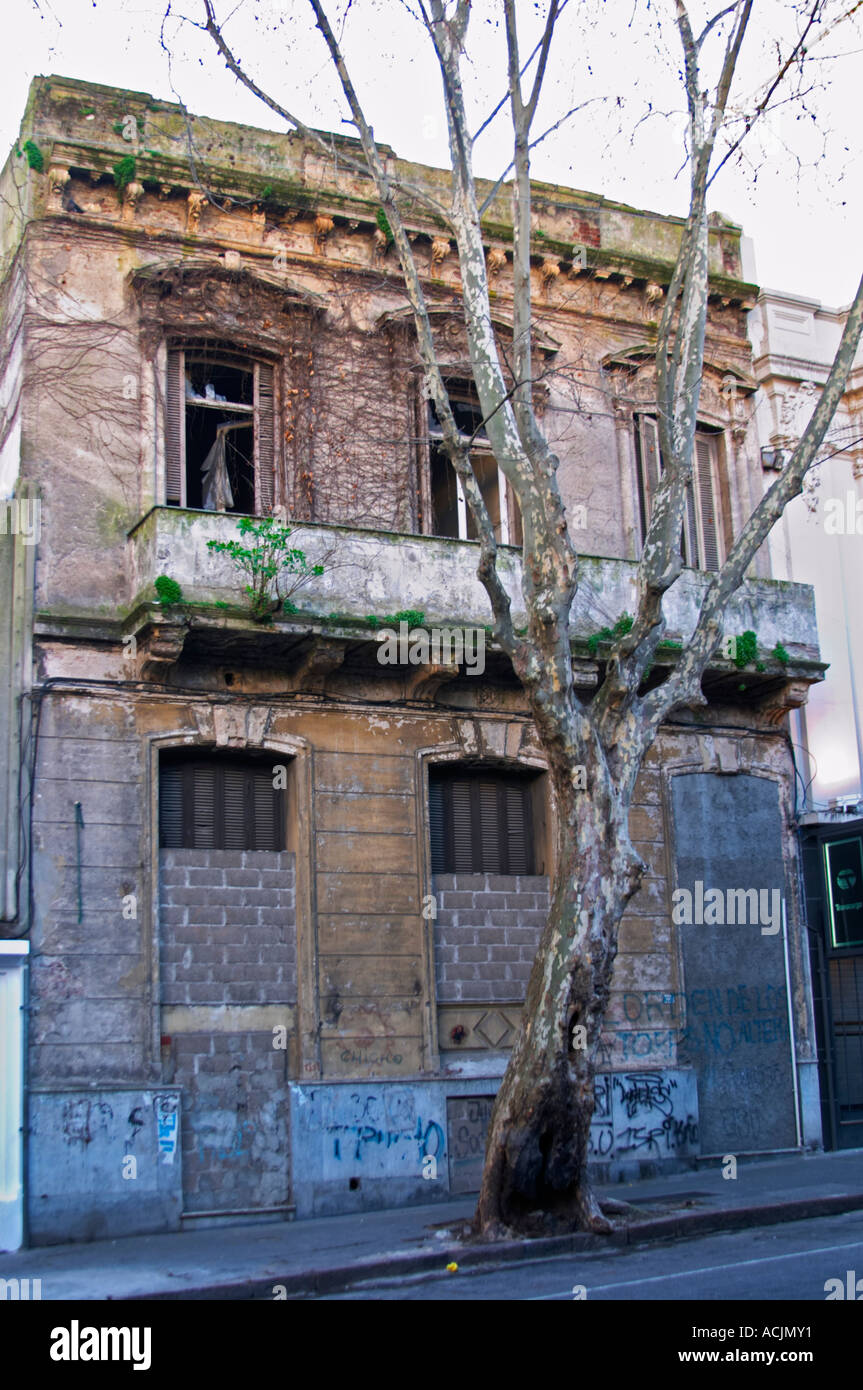 An old run down ruin of a town house building in the city, doors and ...