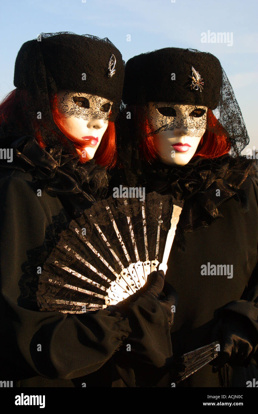 two masked costume characters Venice carnival Stock Photo - Alamy