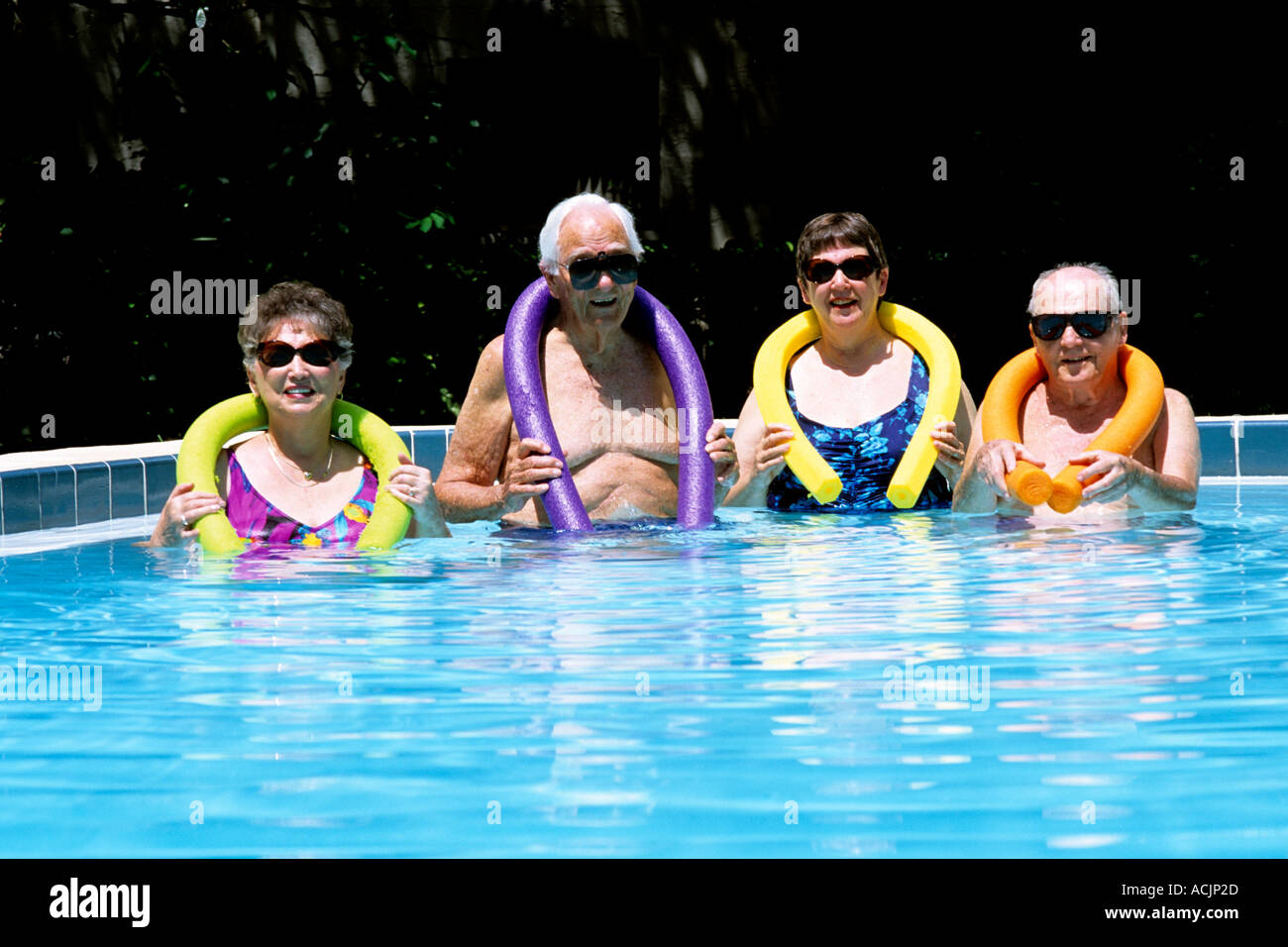Healthy retired seniors having fun in the pool Stock Photo - Alamy