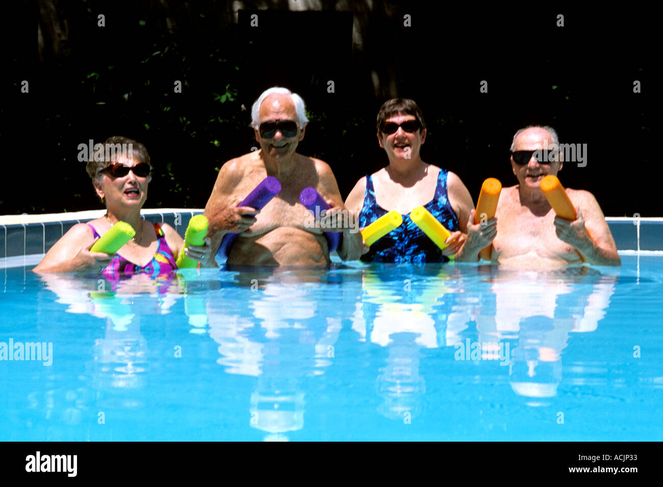 Healthy retired seniors having fun in the pool Stock Photo - Alamy
