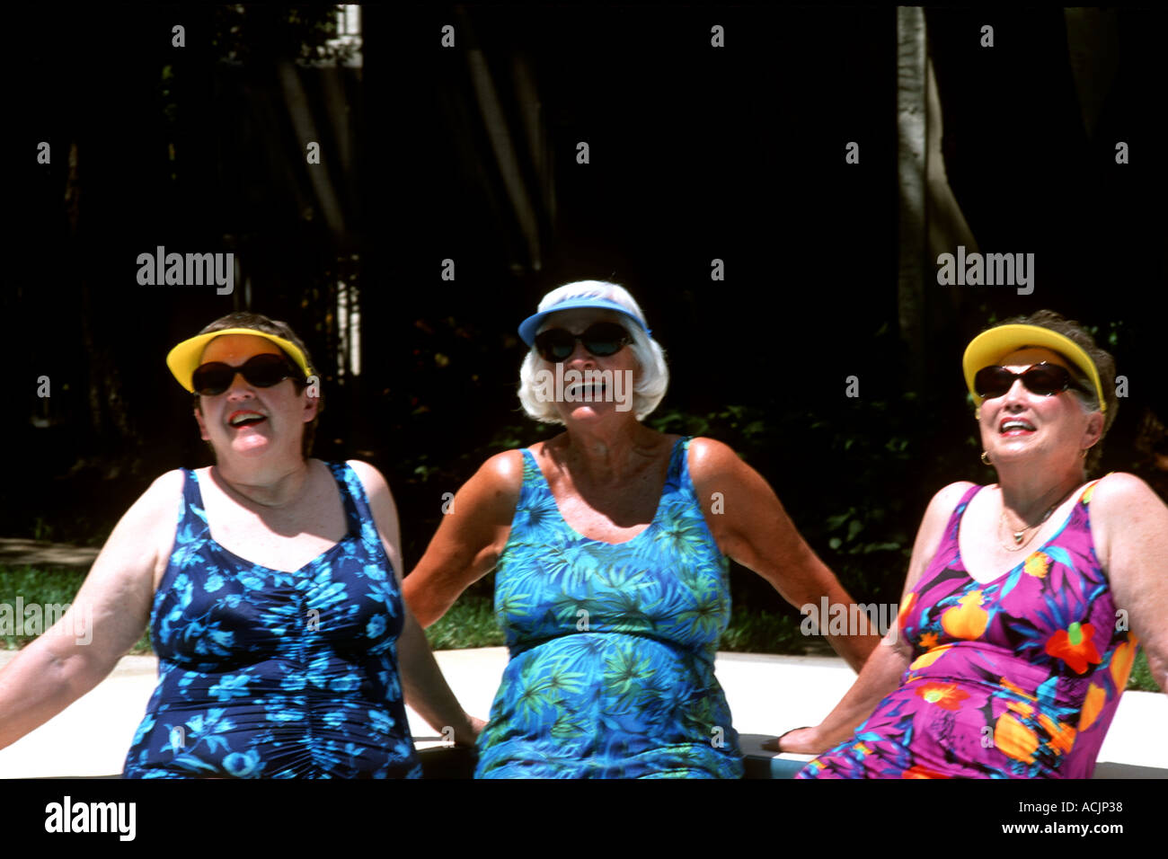 Healthy retired seniors having fun in the pool Stock Photo - Alamy