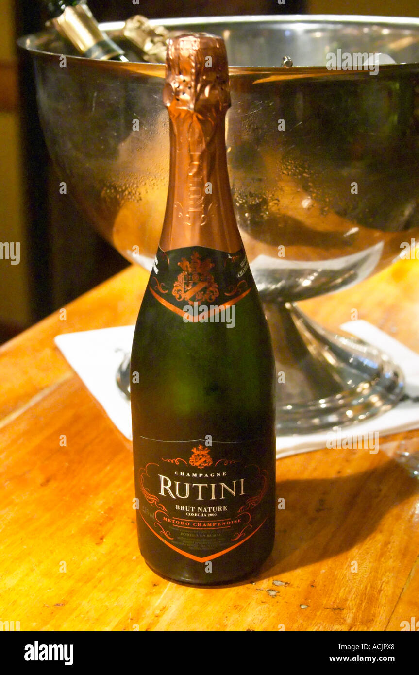 Bottle on a wooden bar counter of Rutini sparkling wine Brut Nature ...