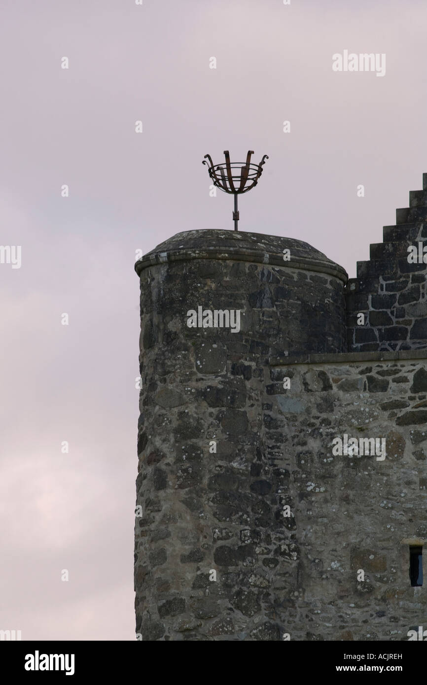 Fire basket beacon on castle parapet against cloudy sky Stock Photo - Alamy