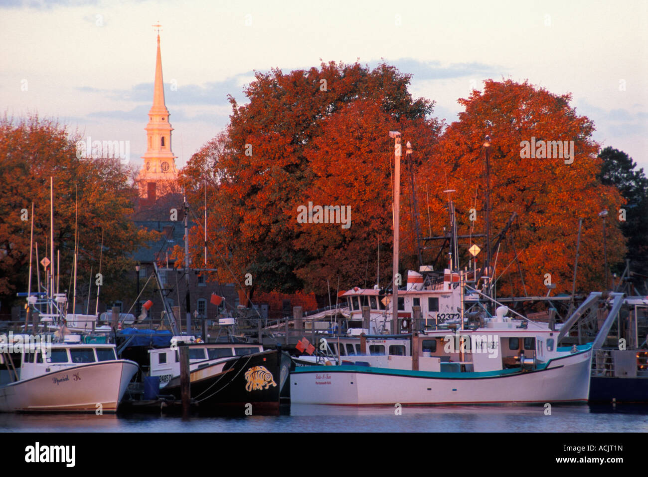 Fishing boats docked on waterfront pier, Portsmouth, NH Stock Photo - Alamy