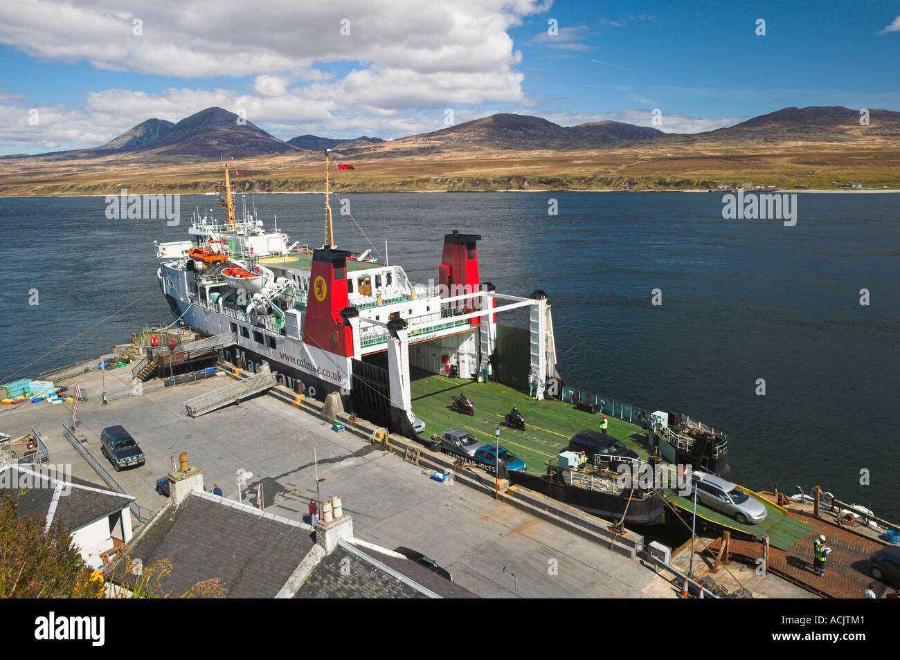 Vehicles disembarking the Caledonian MacBrayne ferry at Port Askaig ...