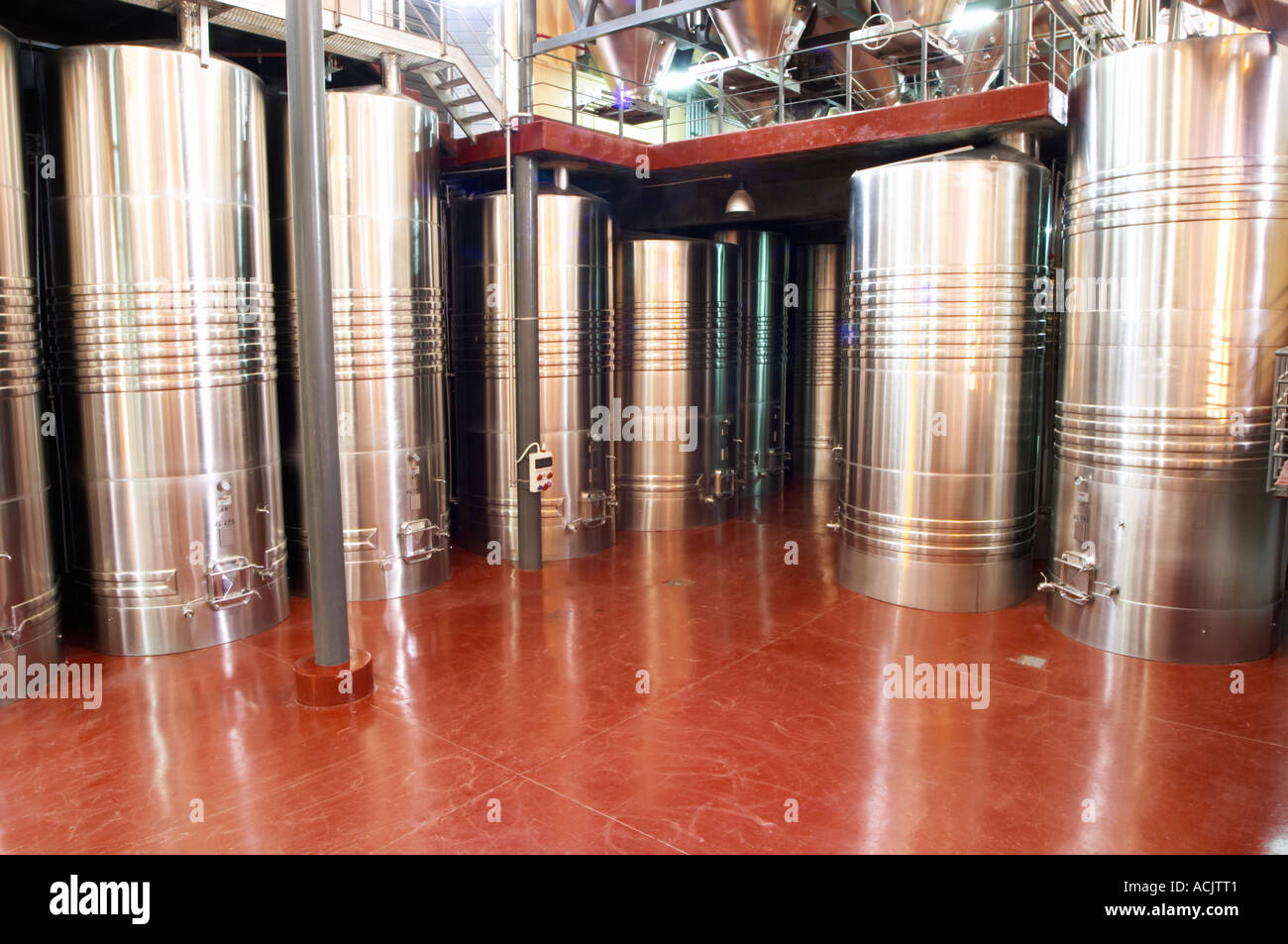 The winery with many big stainless steel fermentation tanks. Bodega ...