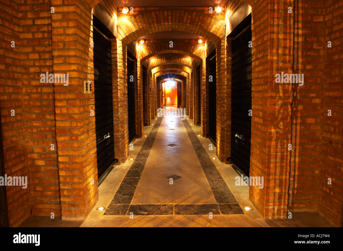 the brick bottle aging cellar with atmospheric lighting Bodega Familia ...