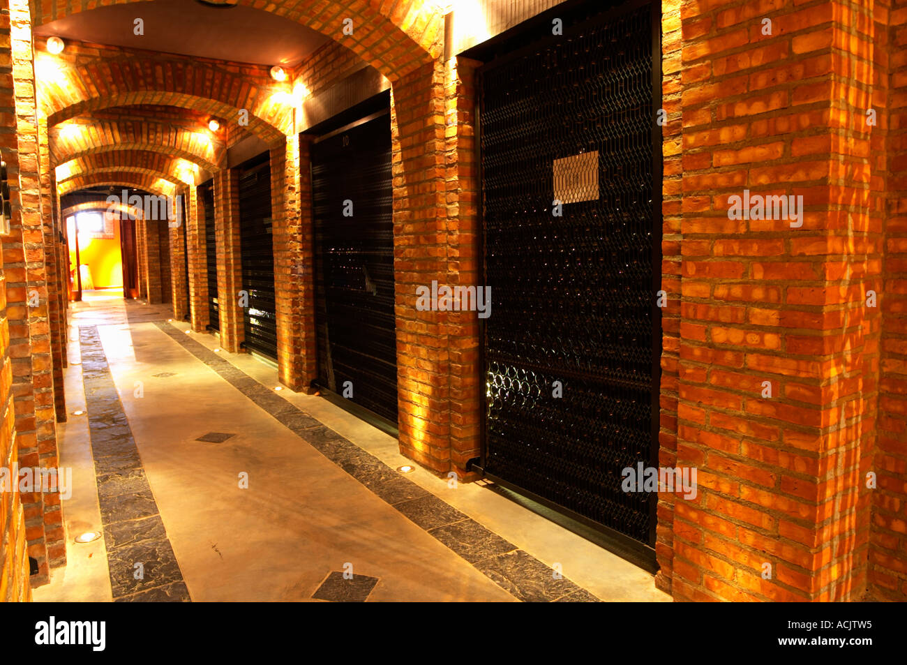 the brick bottle aging cellar with atmospheric lighting Bodega Familia ...