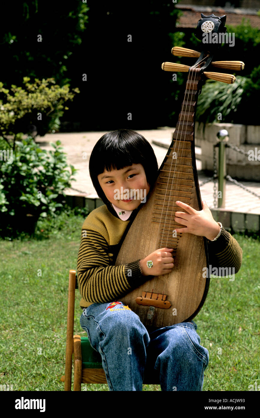 China child playing pi pa instrument hi-res stock photography and ...
