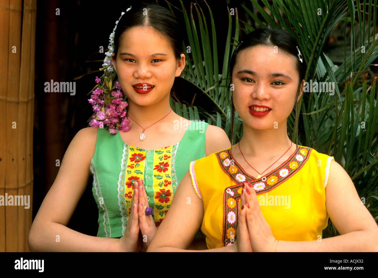 Colorful portrait of two women in Dai traditional costume in China ...