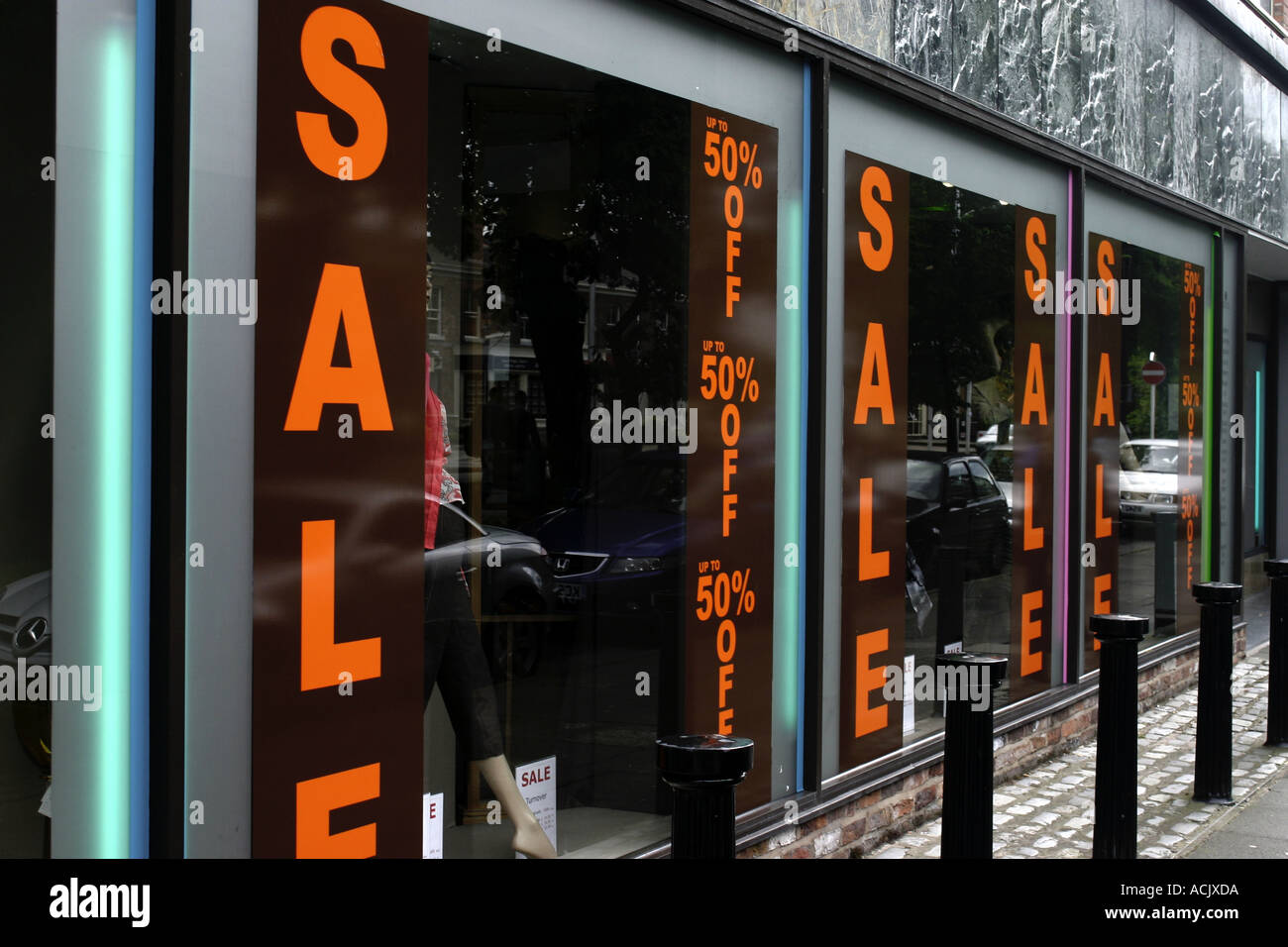 High street shop window 50 percent off sale signs Stock Photo - Alamy