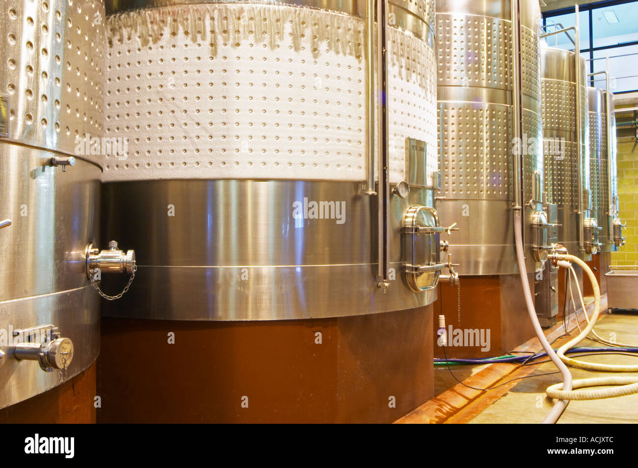The gigantic vat hall with stainless steel fermentation tanks. a tank ...