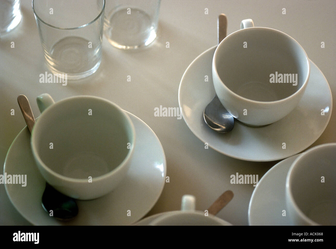 Cups set out on a table Stock Photo - Alamy